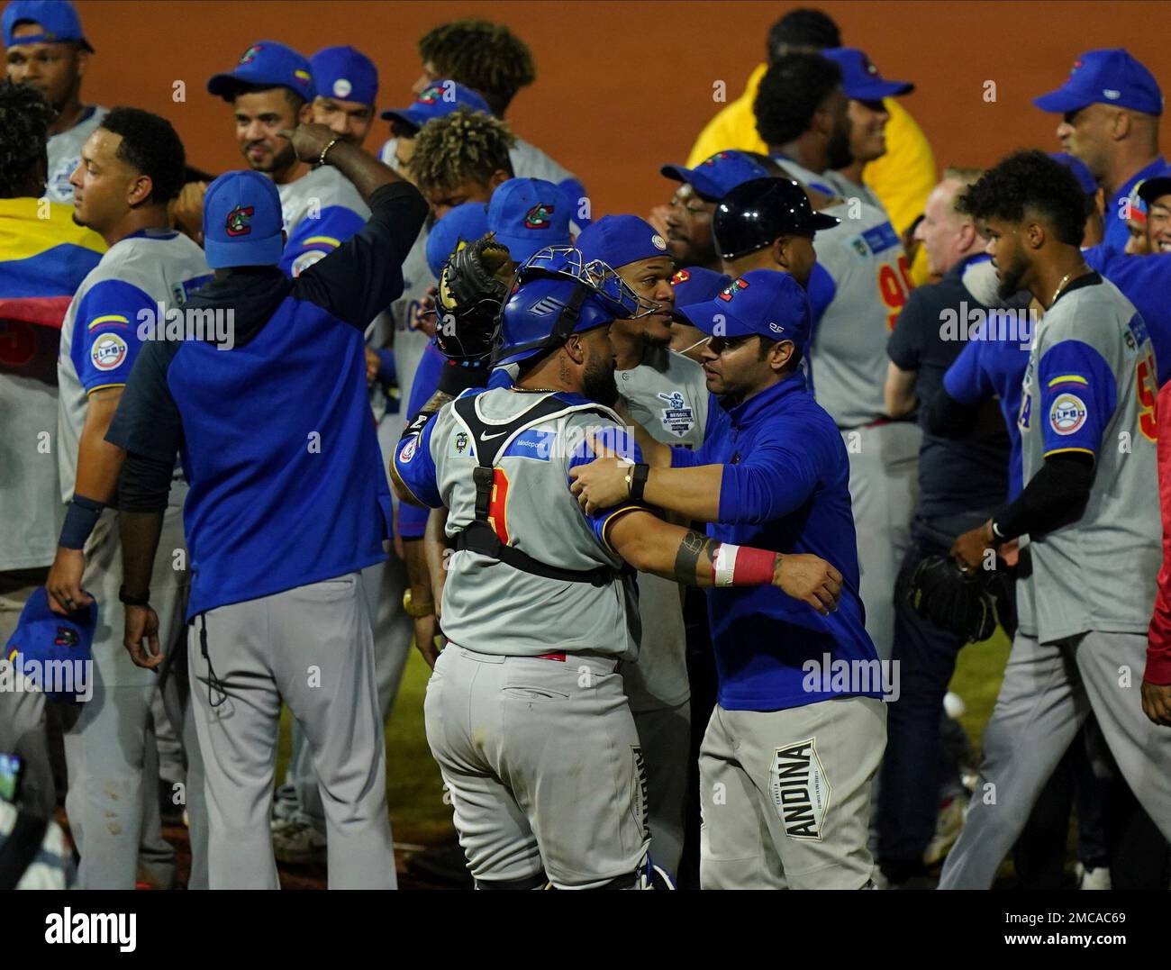 Colombia's coach Jose Mosquera, center right, celebrates with catcher ...