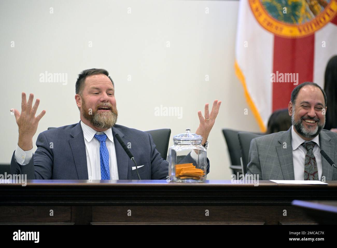 Florida Sen. Aaron Bean, left, makes a point before drawing envelopes ...