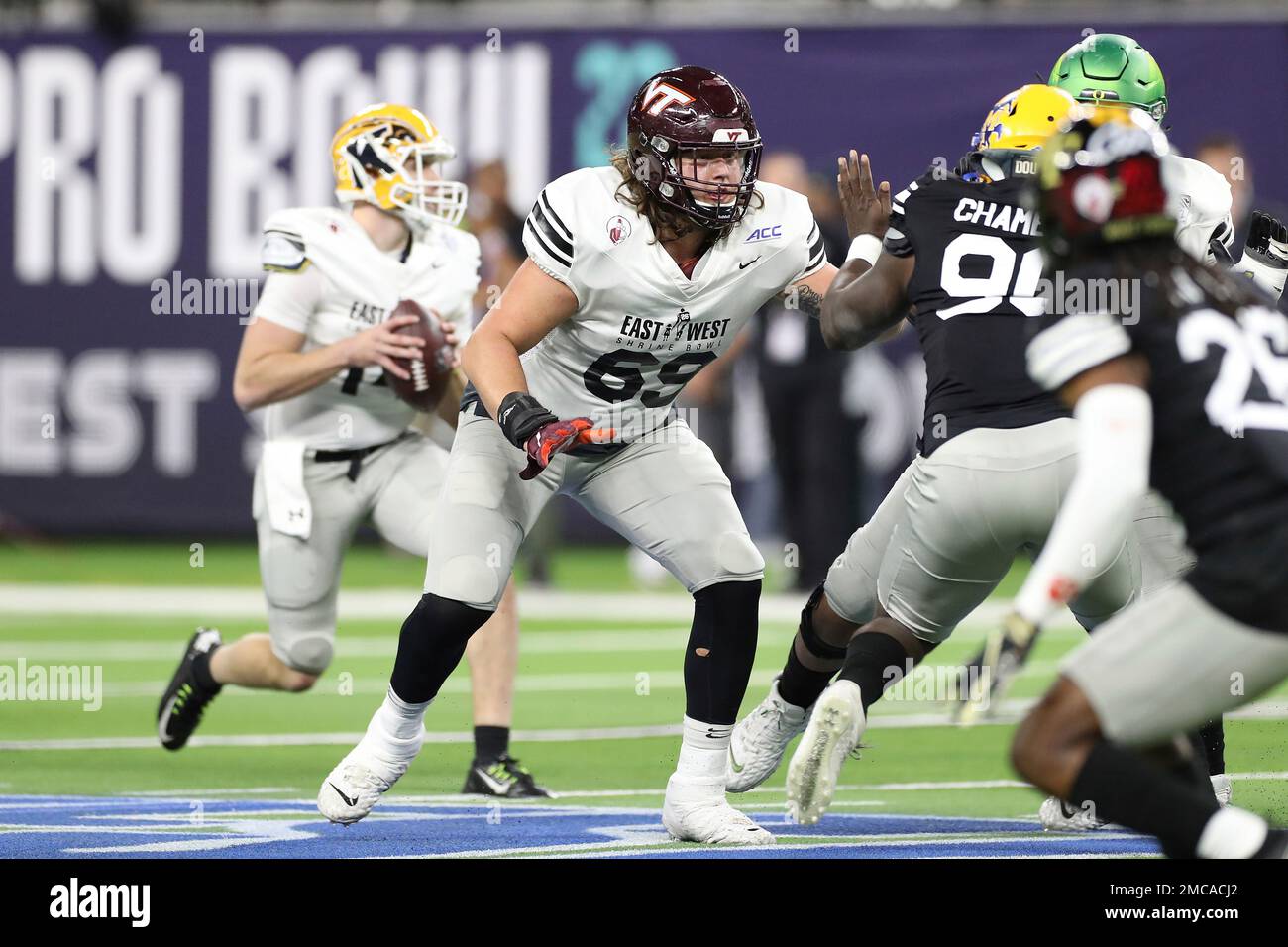East offensive lineman Luke Tenuta, of Virginia Tech, (69) in coverage ...