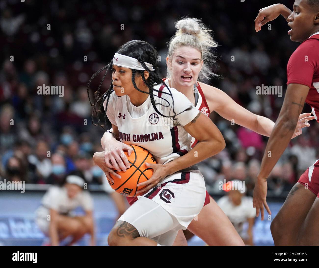 South Carolina guard Destanni Henderson, left, drives to the hoop ...