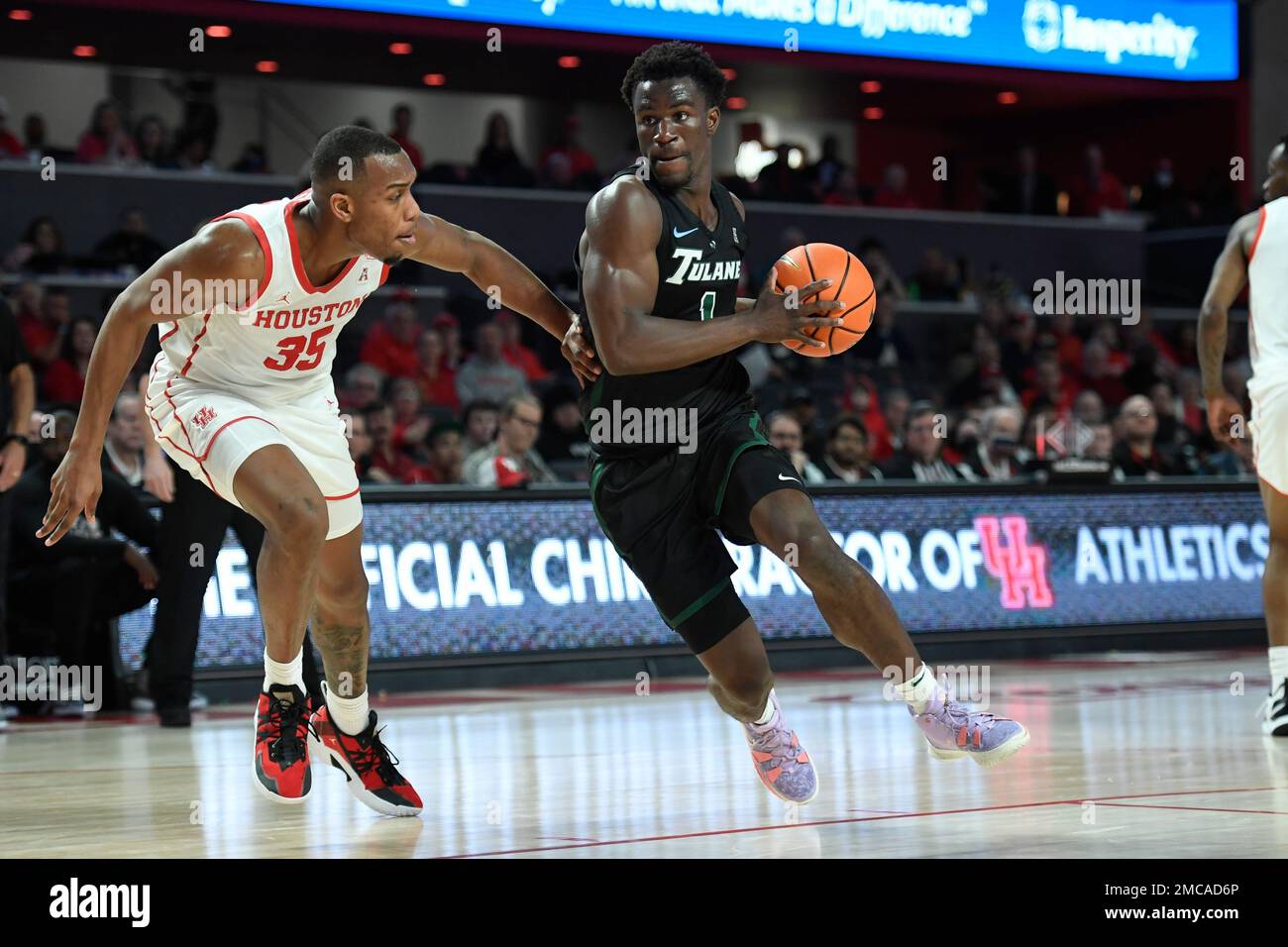 Tulane guard Sion James (1) drives to the basket against Houston ...