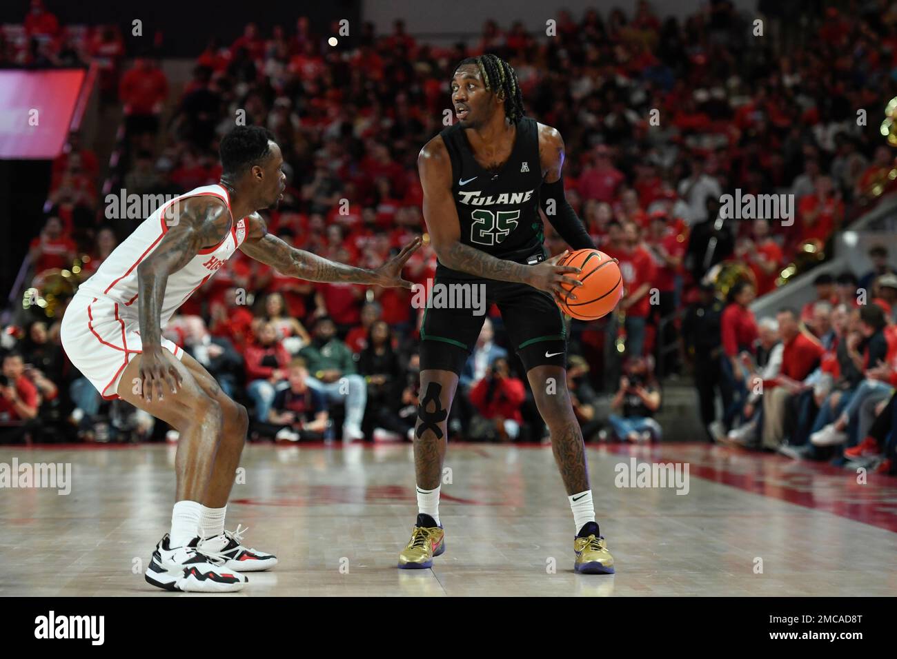 Tulane guard Jaylen Forbes (25) controls the ball against Houston guard ...