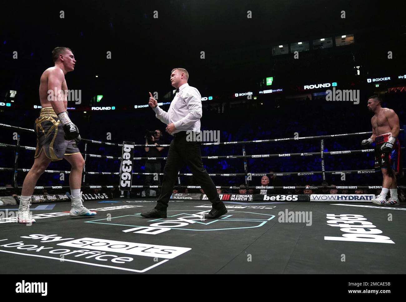 Jack Massey (left) speaks to the referee in the heavyweight bout at the ...