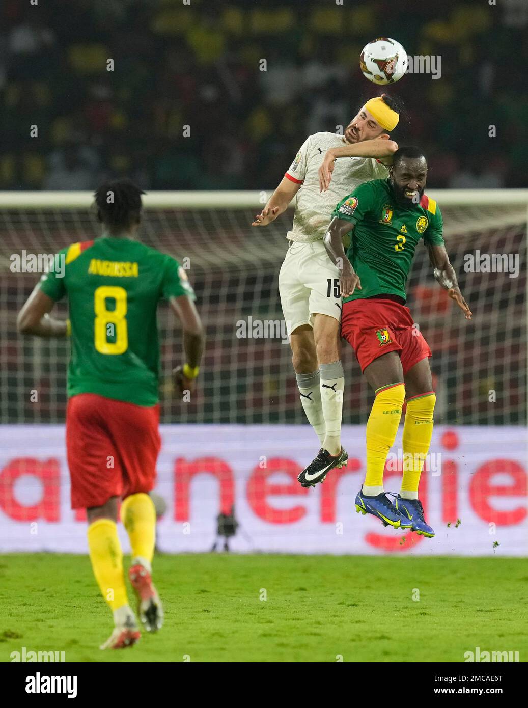 Egypt's Mahmoud Hamdy El-Wensh jumps for the ball with Cameroon's Moumi ...
