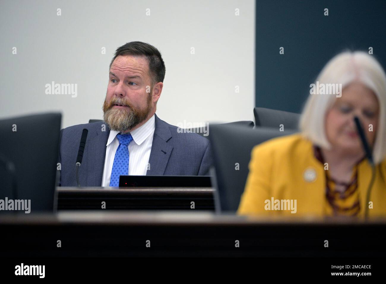 Florida Sen. Aaron Bean, left, speaks during a Senate Committee on ...