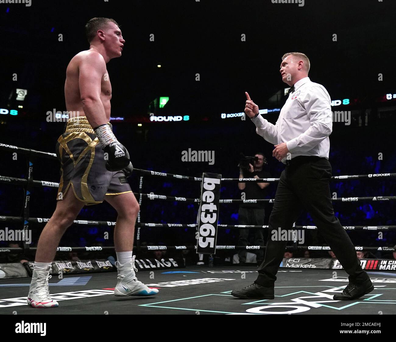 Jack Massey (left) speaks to the referee in the heavyweight bout at the ...
