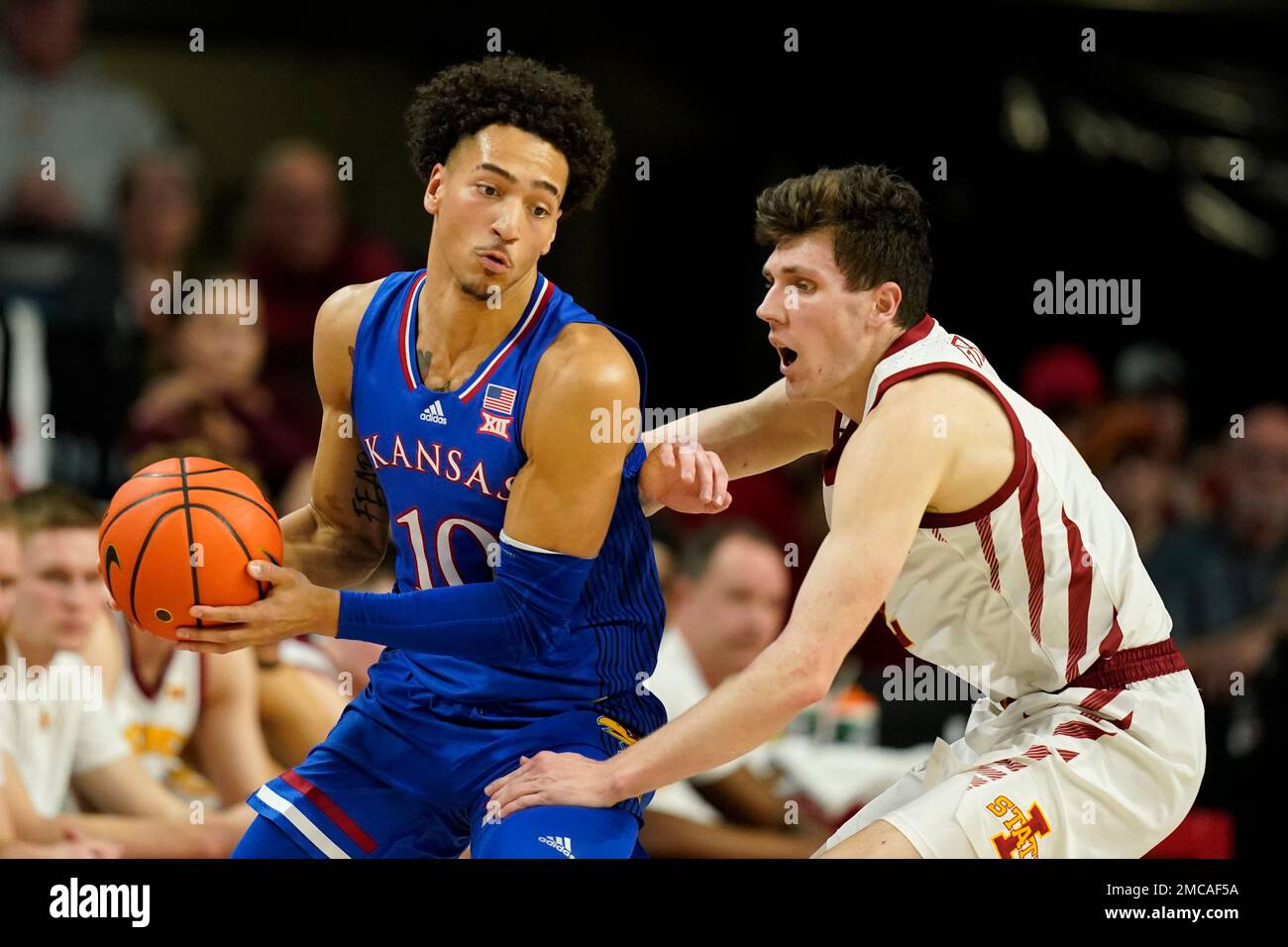 Kansas forward Jalen Wilson (10) drives around Iowa State guard Caleb ...