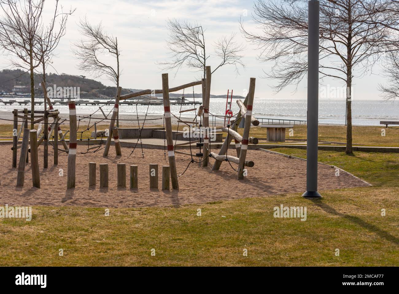 Wooden obstacle course at a playground by a beach Stock Photo - Alamy