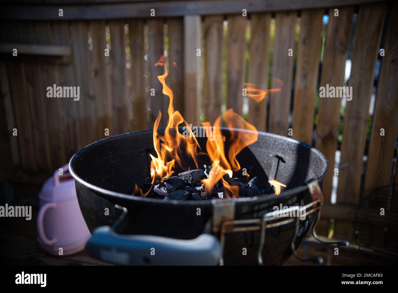 Lit barbeque getting really hot Stock Photo - Alamy