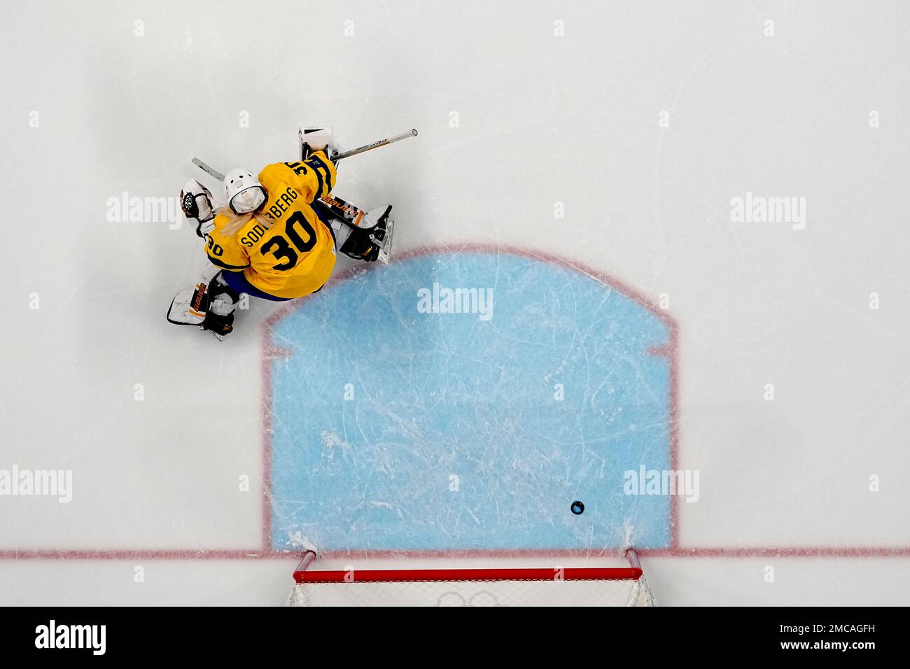 A shot by Japan's Rui Ukita, not shown, gets past Sweden goalkeeper ...
