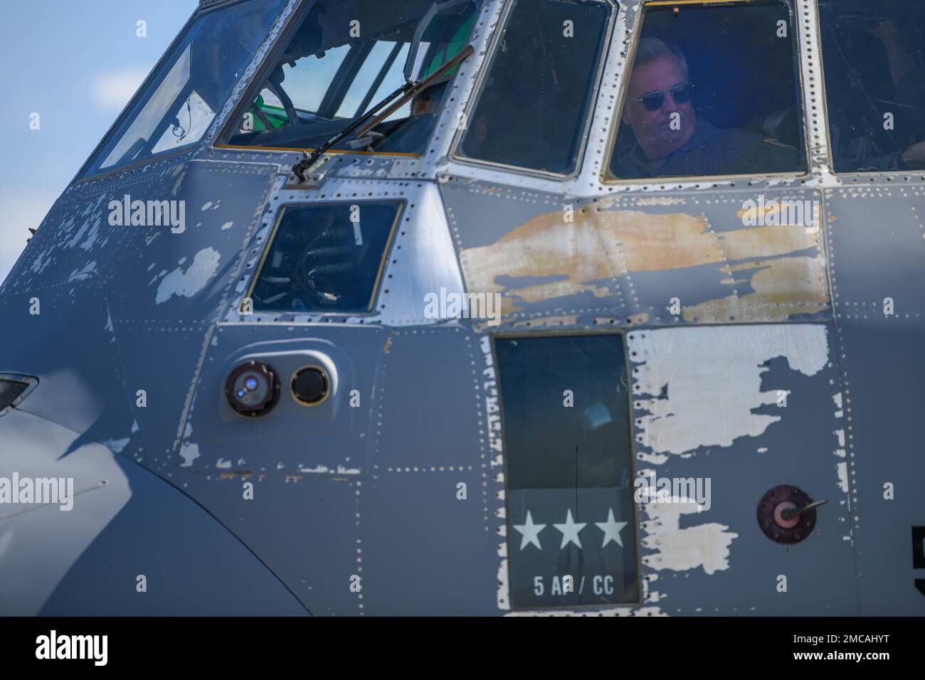 Lt. Gen. Ricky Rupp, 5th Air Force commander, looks out a window of a C ...