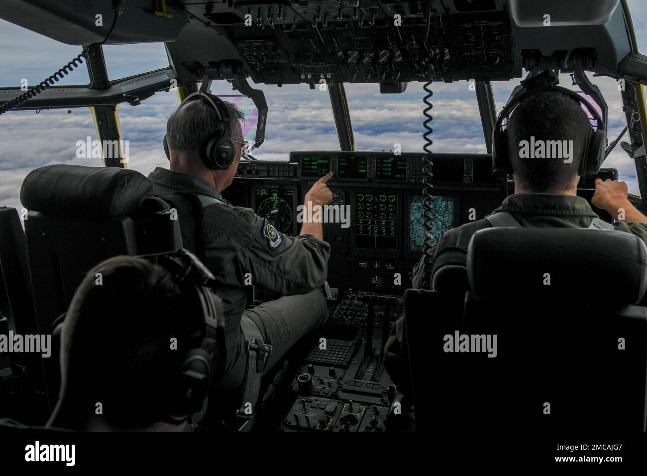 Lt. Gen. Ricky Rupp, 5th Air Force commander, adjusts controls in a C ...
