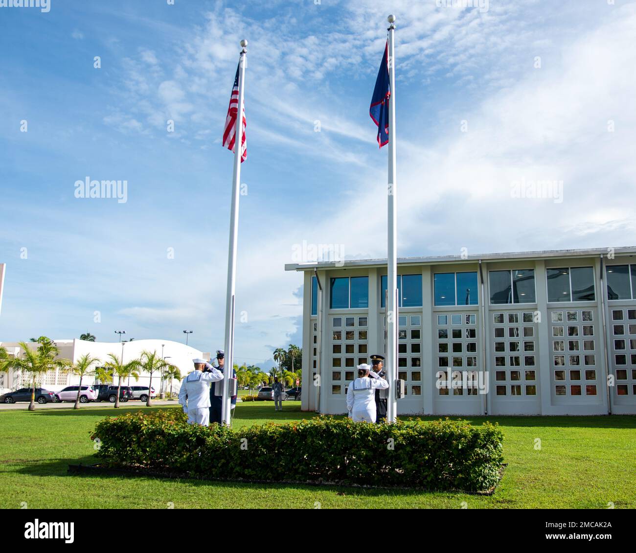 Hagåtña, Guam — Flag detail members salute the American flag and Guam ...