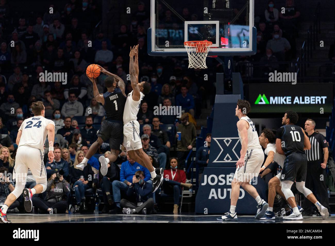 Butler guard Bo Hodges (1) shoots over Xavier's Nate Johnson during the ...