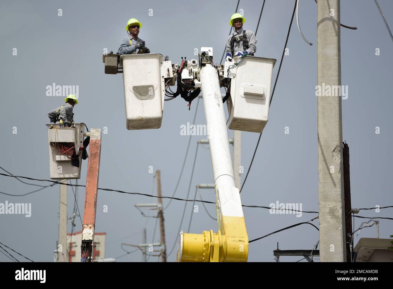 FILE - Puerto Rico Electric Power Authority workers repair distribution ...