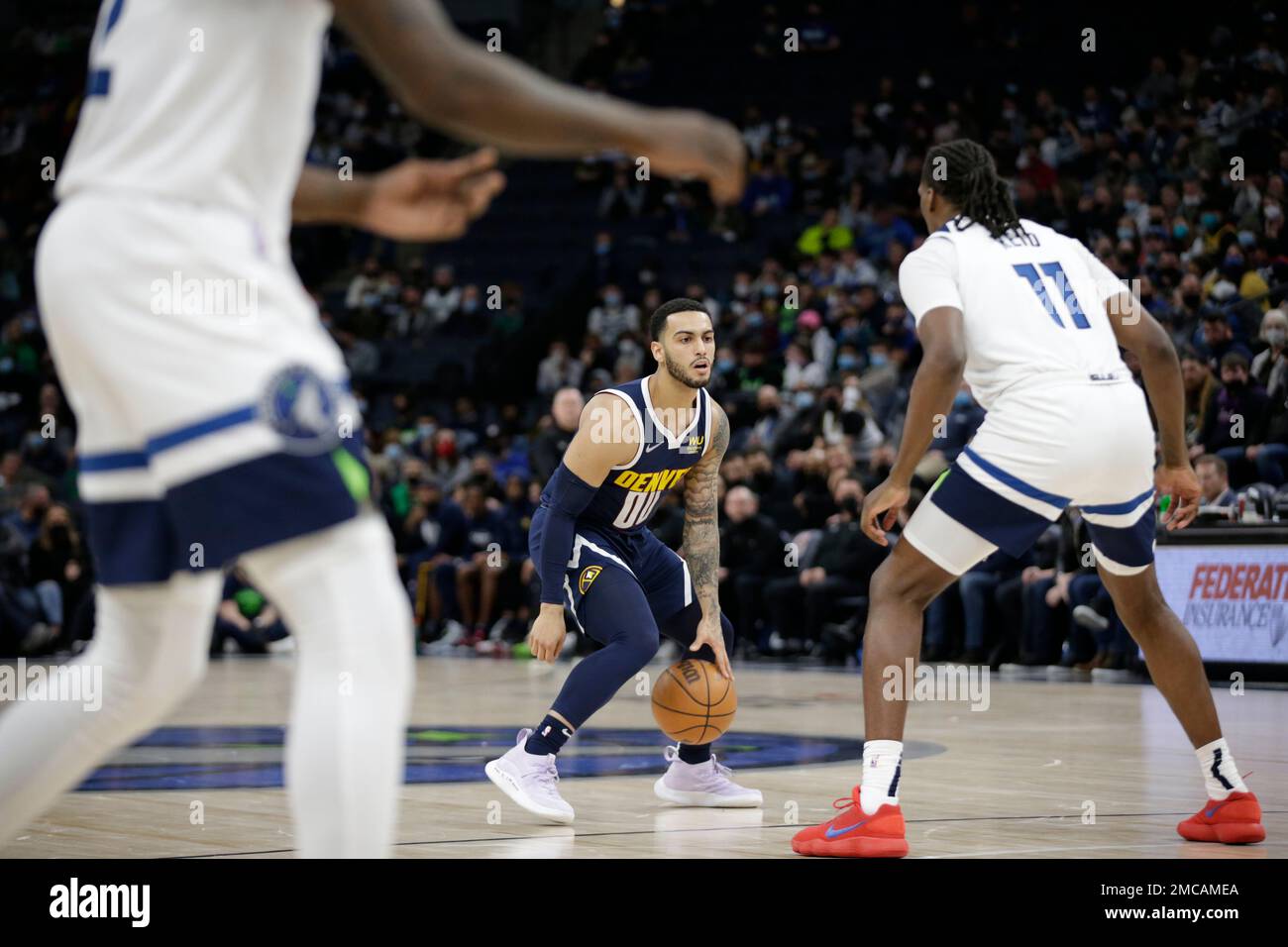 Denver Nuggets guard Markus Howard (00) drives on Minnesota ...