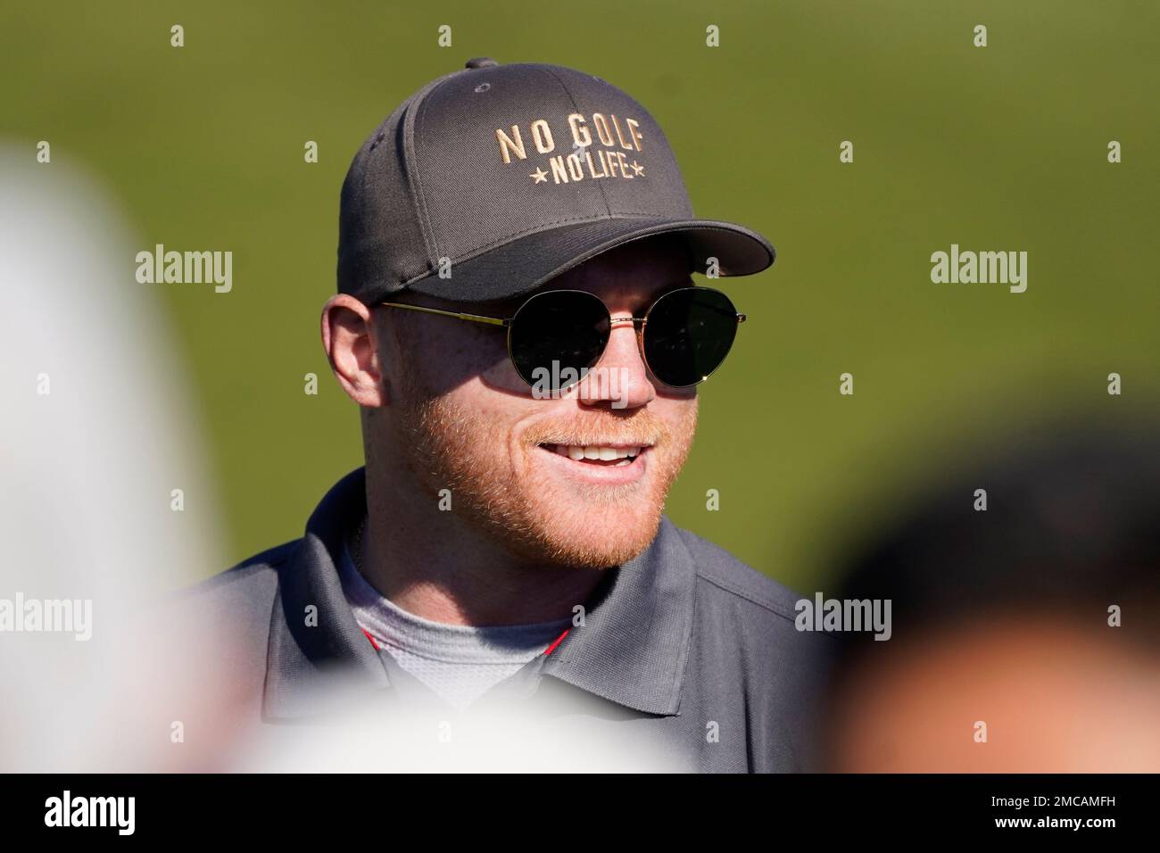 Canelo Alvarez, of Mexico, competes in the charity putting event of the ...