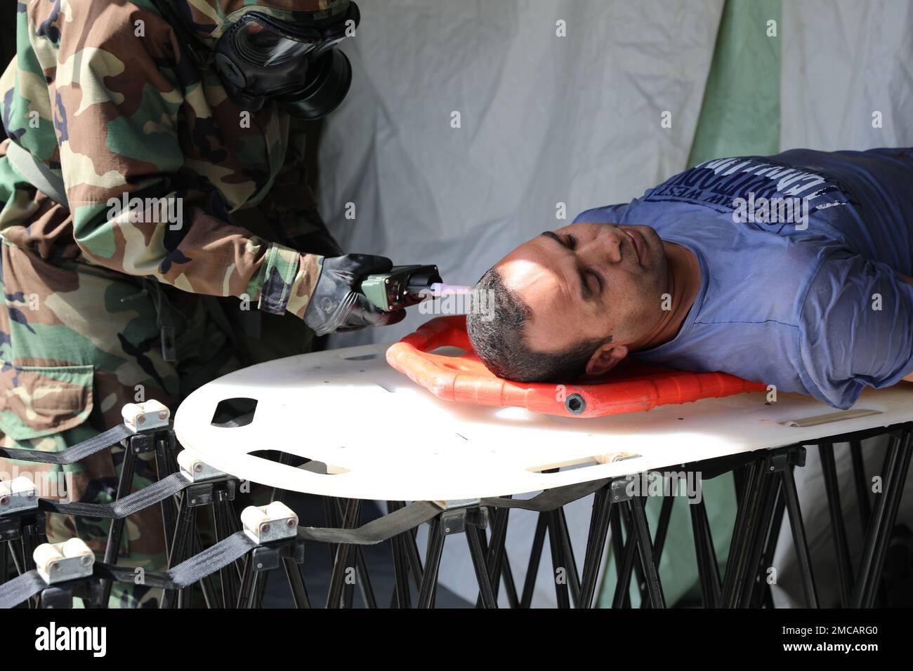 An actor with simulated injuries get checked for remaining chemical ...