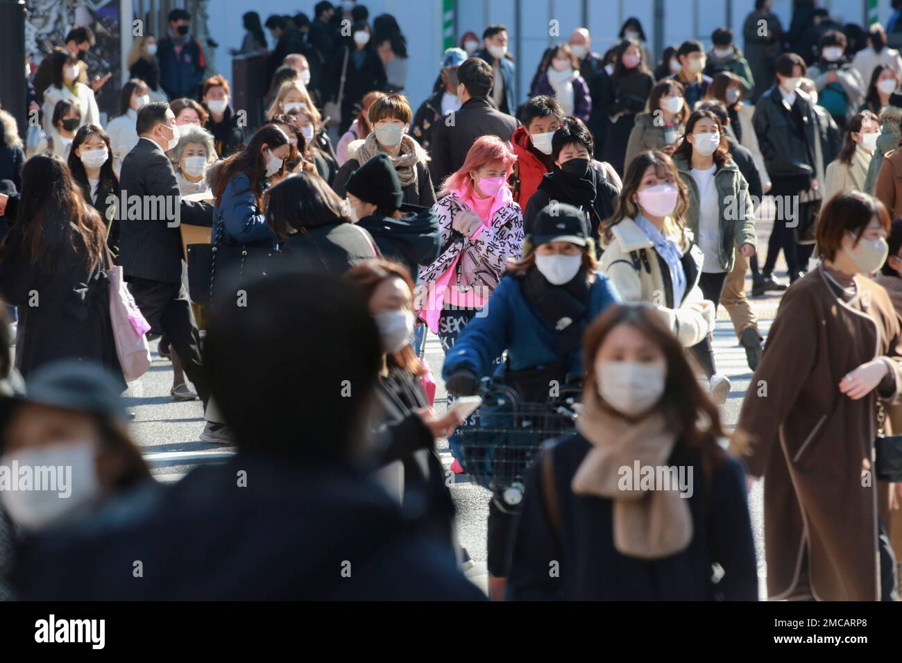 People wearing face masks to protect against the spread of the ...
