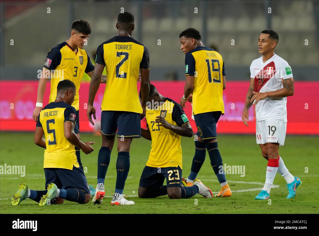 Ecuador's players pray at the end of a qualifying soccer match for the ...