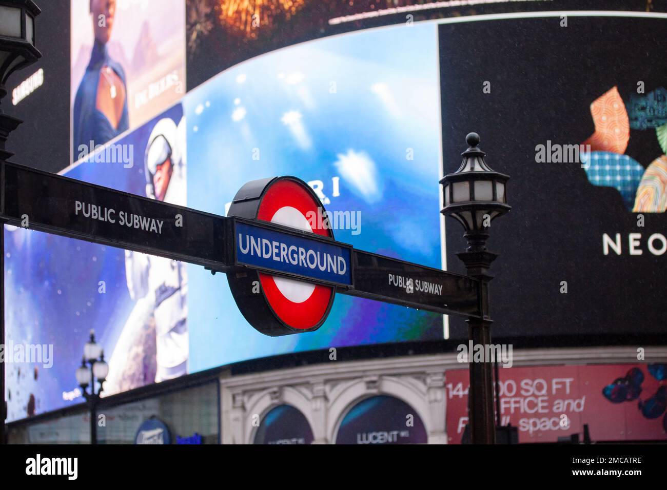 Piccadilly Circus road junction with illuminated London Underground ...