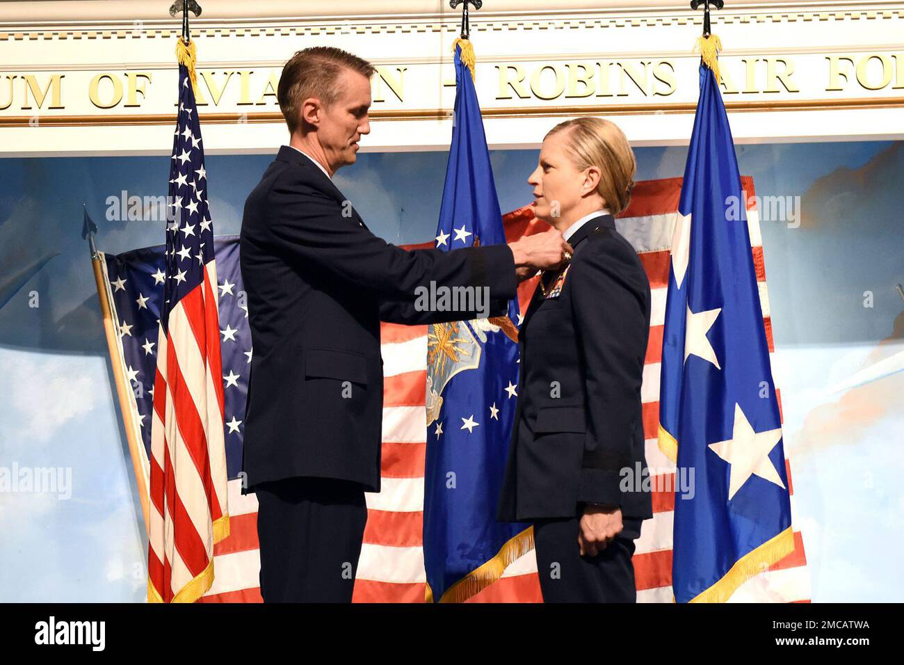 Lt. Gen. Tom Miller, Air Force Sustainment Center commander, pins the ...