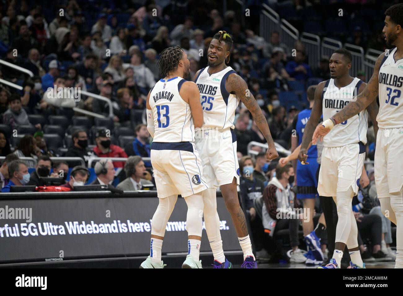 Dallas Mavericks forward Reggie Bullock (25) celebrates with guard ...