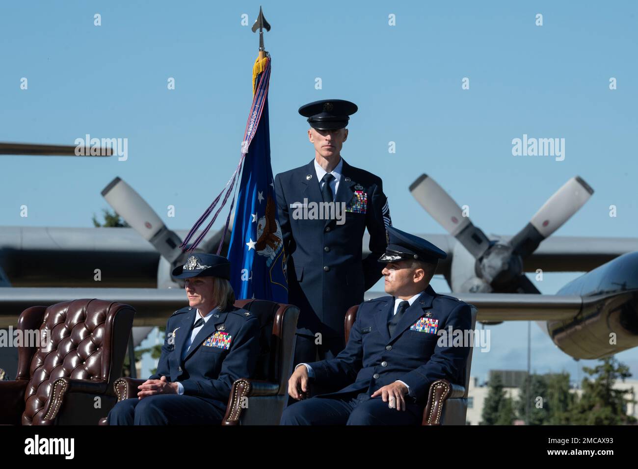 U.S. Air Force Chief Master Sgt. Lee Mills, center, guards the colors ...