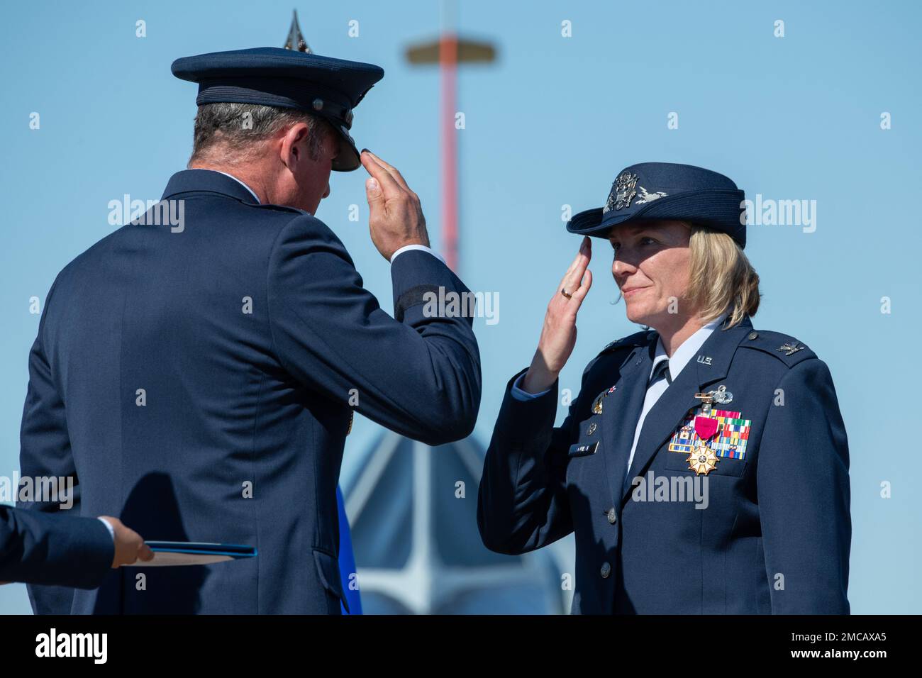 U.S. Air Force Col. Kirsten Aguilar salutes Lt. Gen. David A. Krumm ...