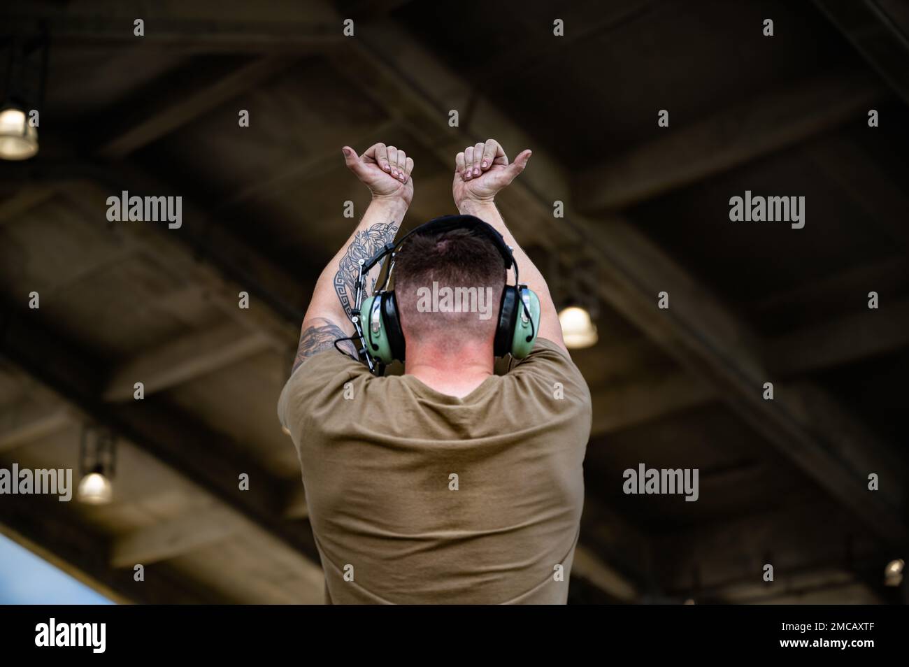 A 67th Aircraft Maintenance Unit dedicated crew chief gives hand ...