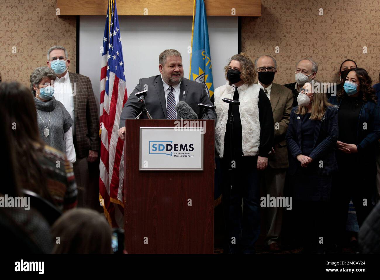 South Dakota Rep. Jamie Smith, center, announces his candidacy for ...