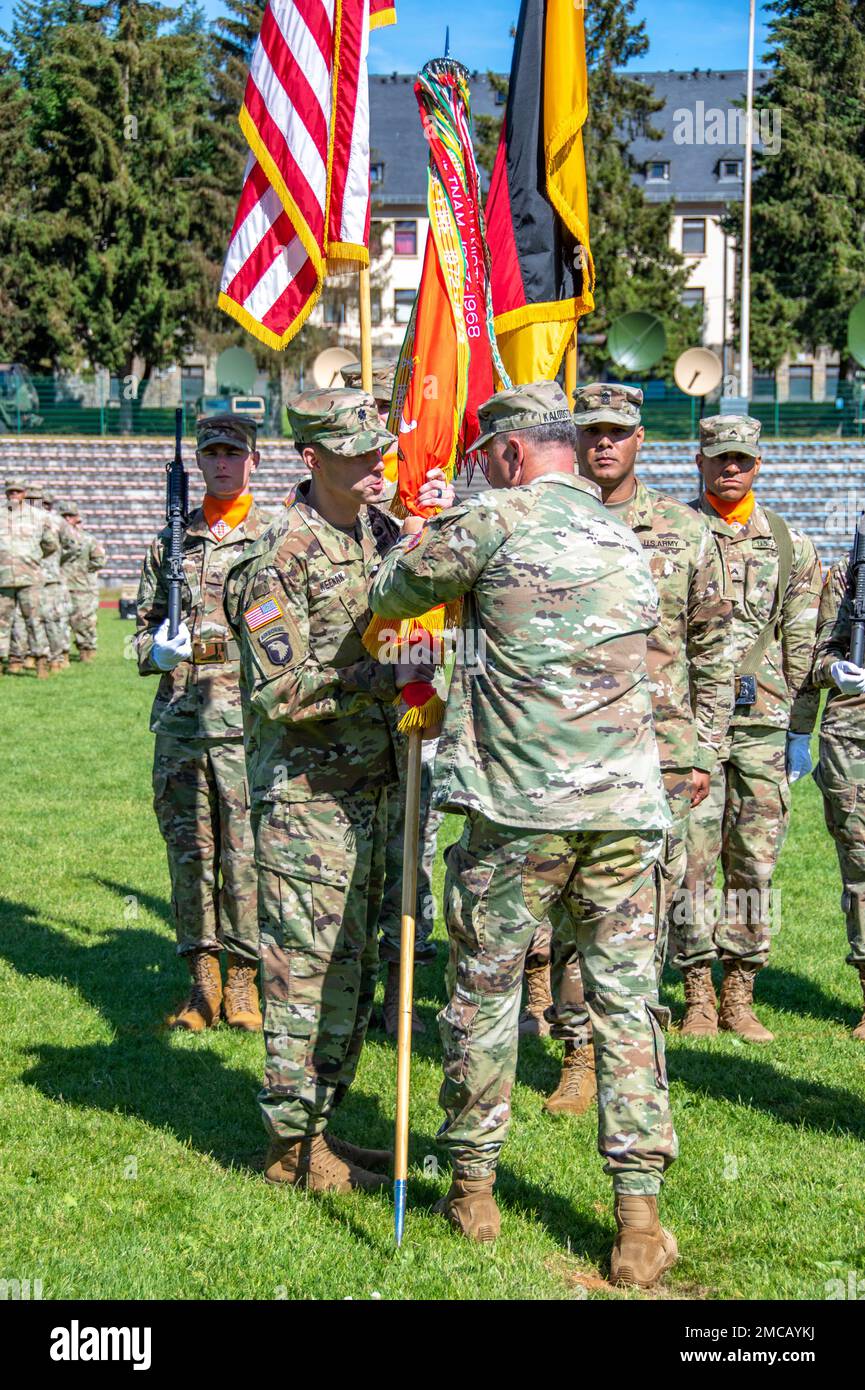 U.S. Army Lt. Col. Jeffrey Keenan, receives the unit colors from Col. Michael Kaloostian, 2nd ...