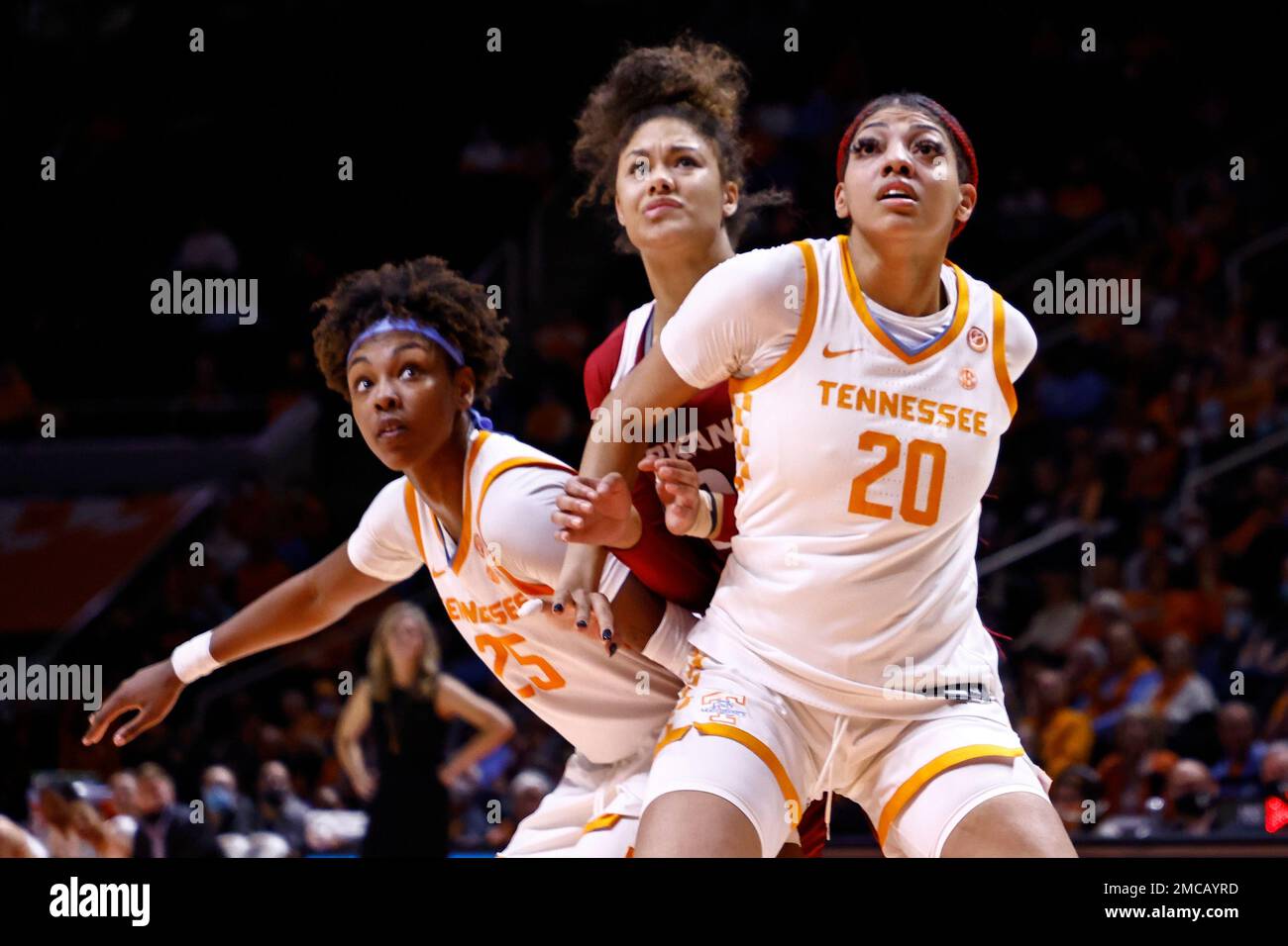 Tennessee center Tamari Key (20) blocks out against Arkansas guard ...