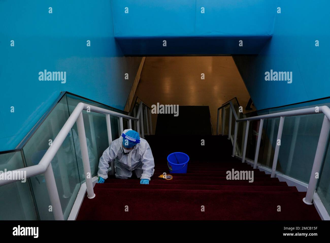 A person cleans at the Curling venue ahead of the Beijing 2022 Winter ...
