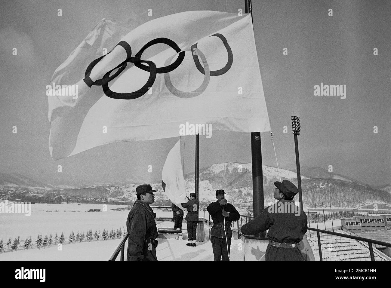 FILE - Members of Japan's self-defense ground forces raise Olympic ...