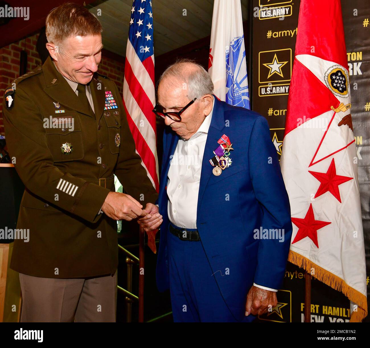 The Chief of Staff of the Army, Gen. James C. McConville, congratulates ...