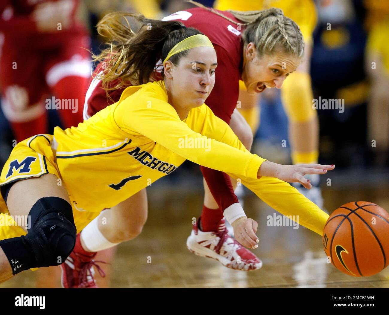 Michigan guard Amy Dilk, left, and Indiana guard Kaitlin Peterson ...