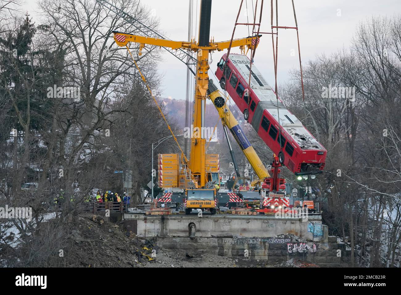 A Crane hoists a Pittsburgh Transit Authority bus on Monday Jan. 31 ...