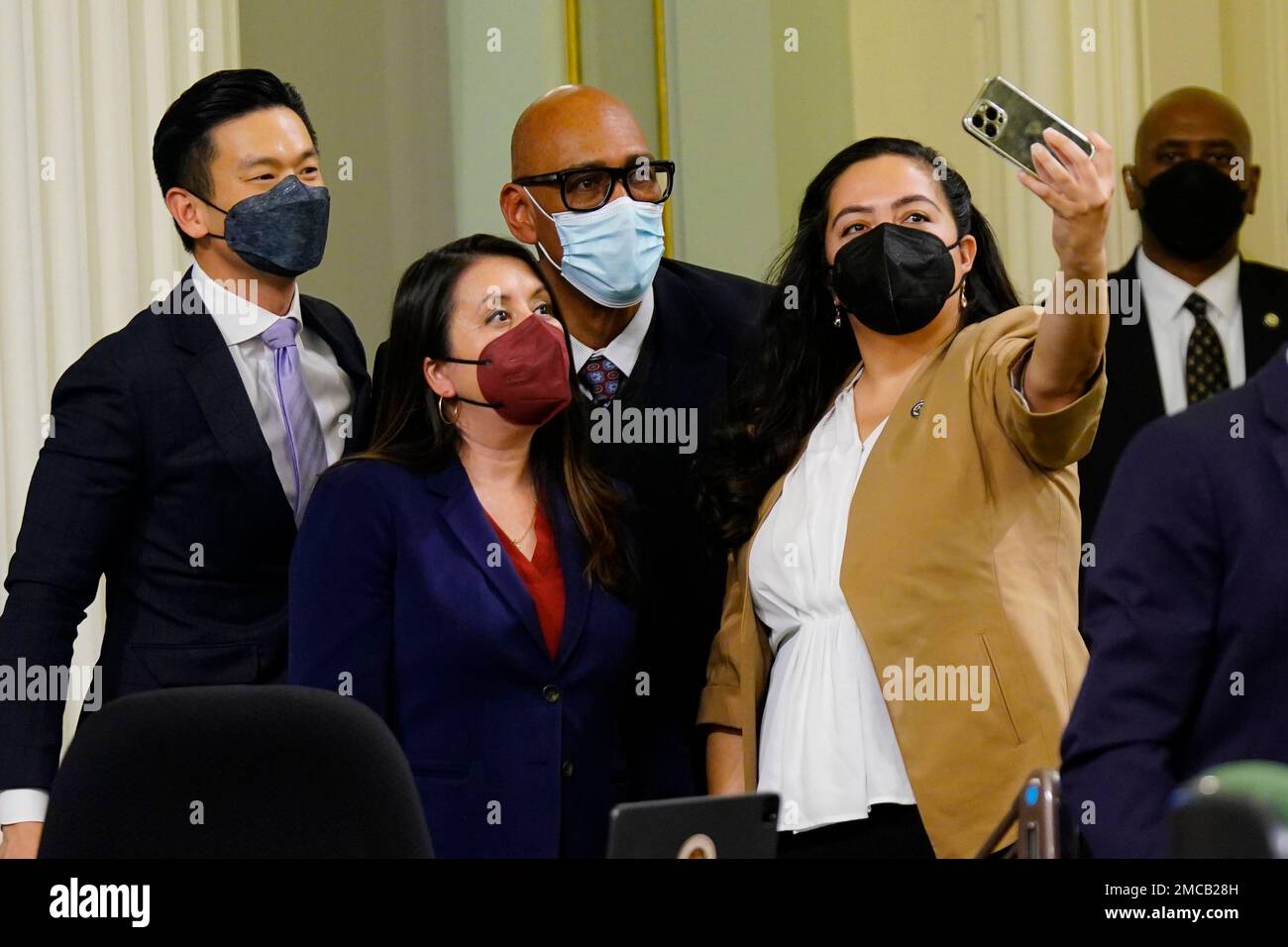 Democratic Assemblyman Chris Holden, third from left, poses for a photo ...