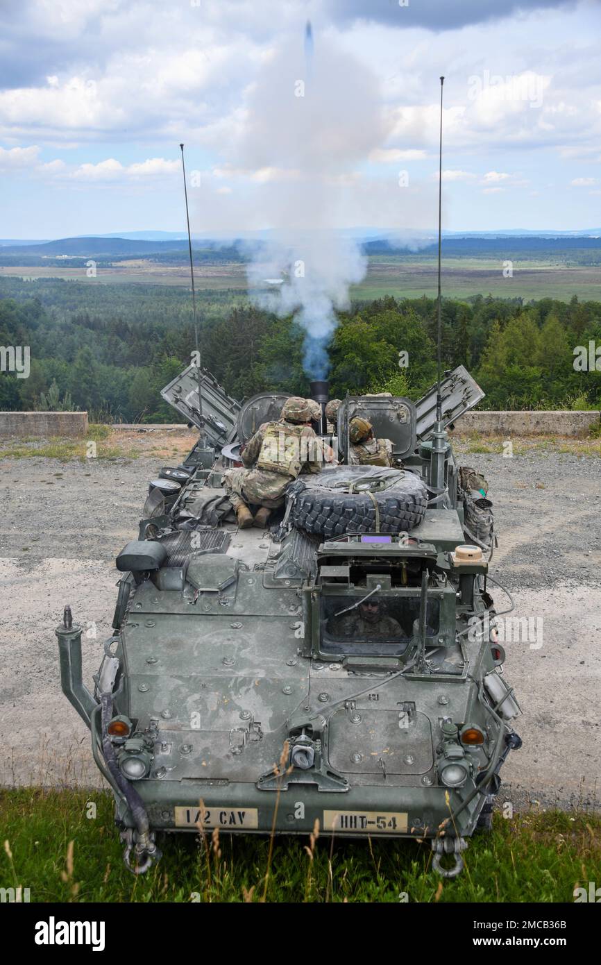 U.S. Soldiers assigned to 1st Squadron, 2nd Cavalry Regiment fire 120mm ...