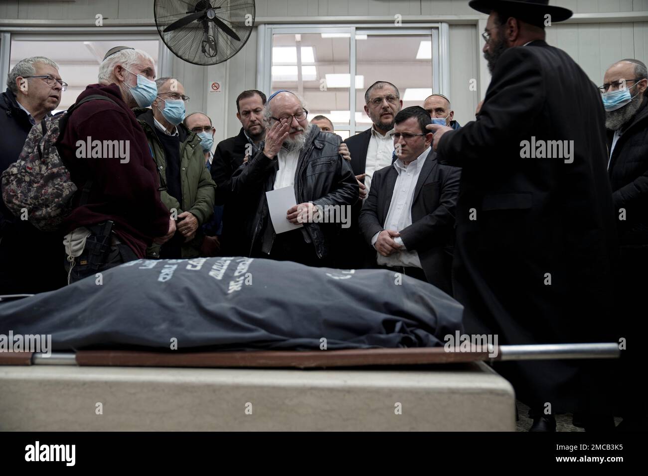 Jonathan Pollard, center, weeps at the funeral for his wife, Esther ...