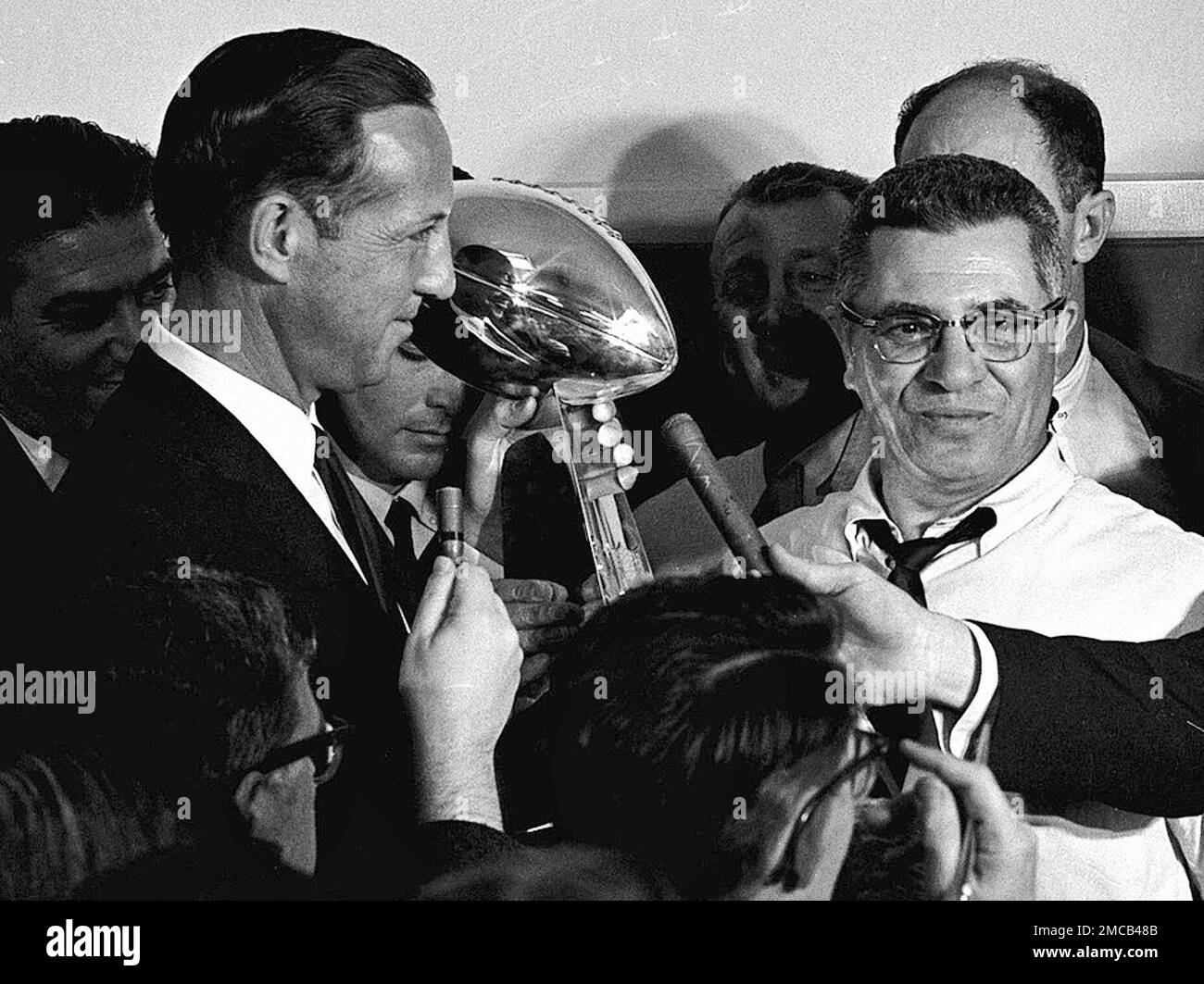 FILE - Football commissioner Pete Rozelle, left, presents the trophy to ...