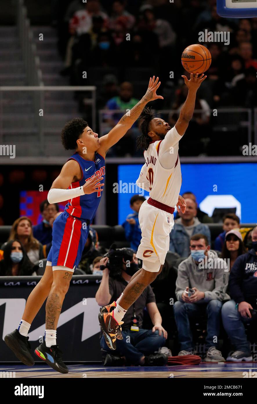 Cleveland Cavaliers guard Darius Garland, right, goes the the basket ...