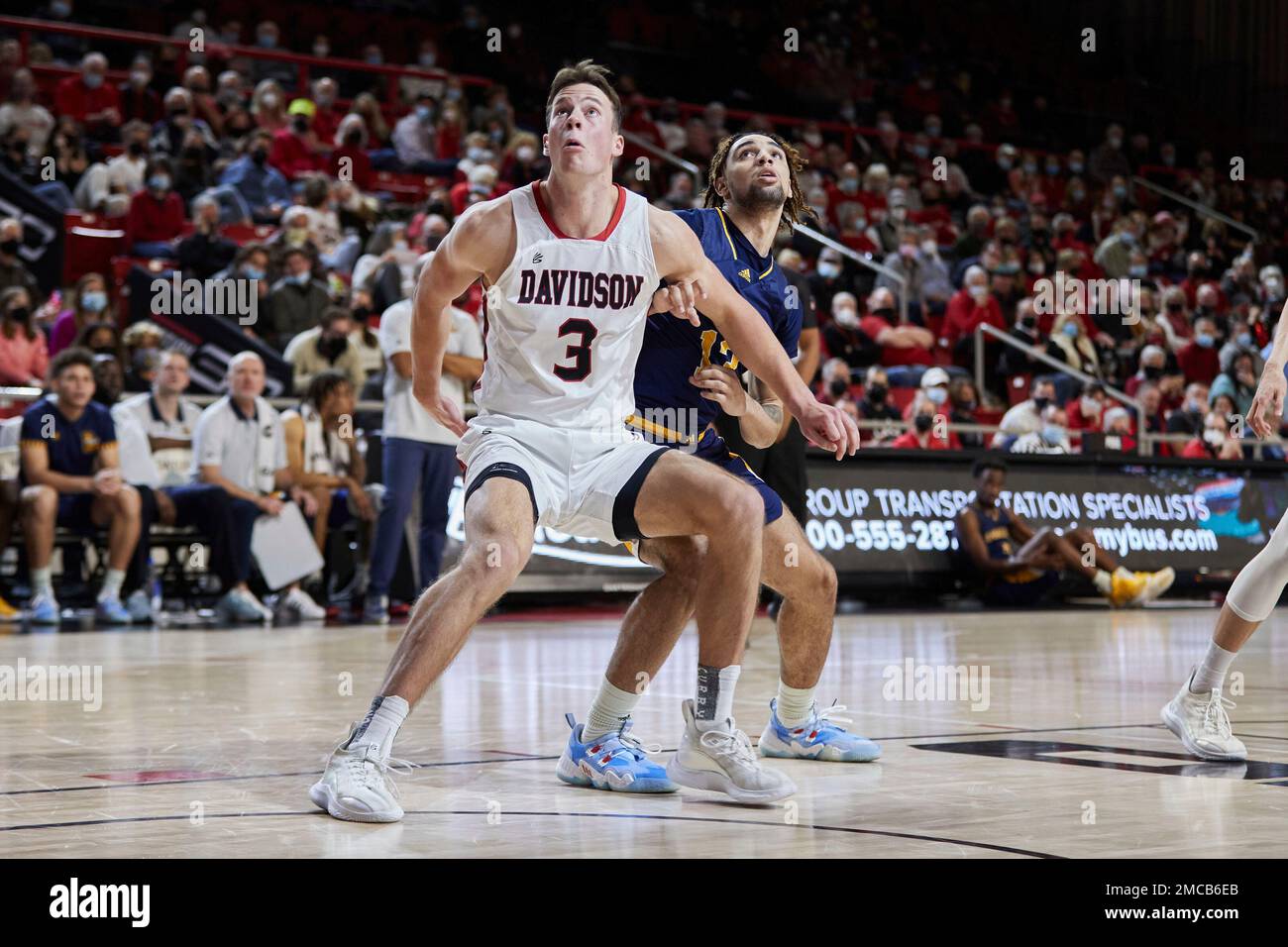 Davidson forward Sam Mennenga (3) boxes out La Salle guard Anwar Gill ...