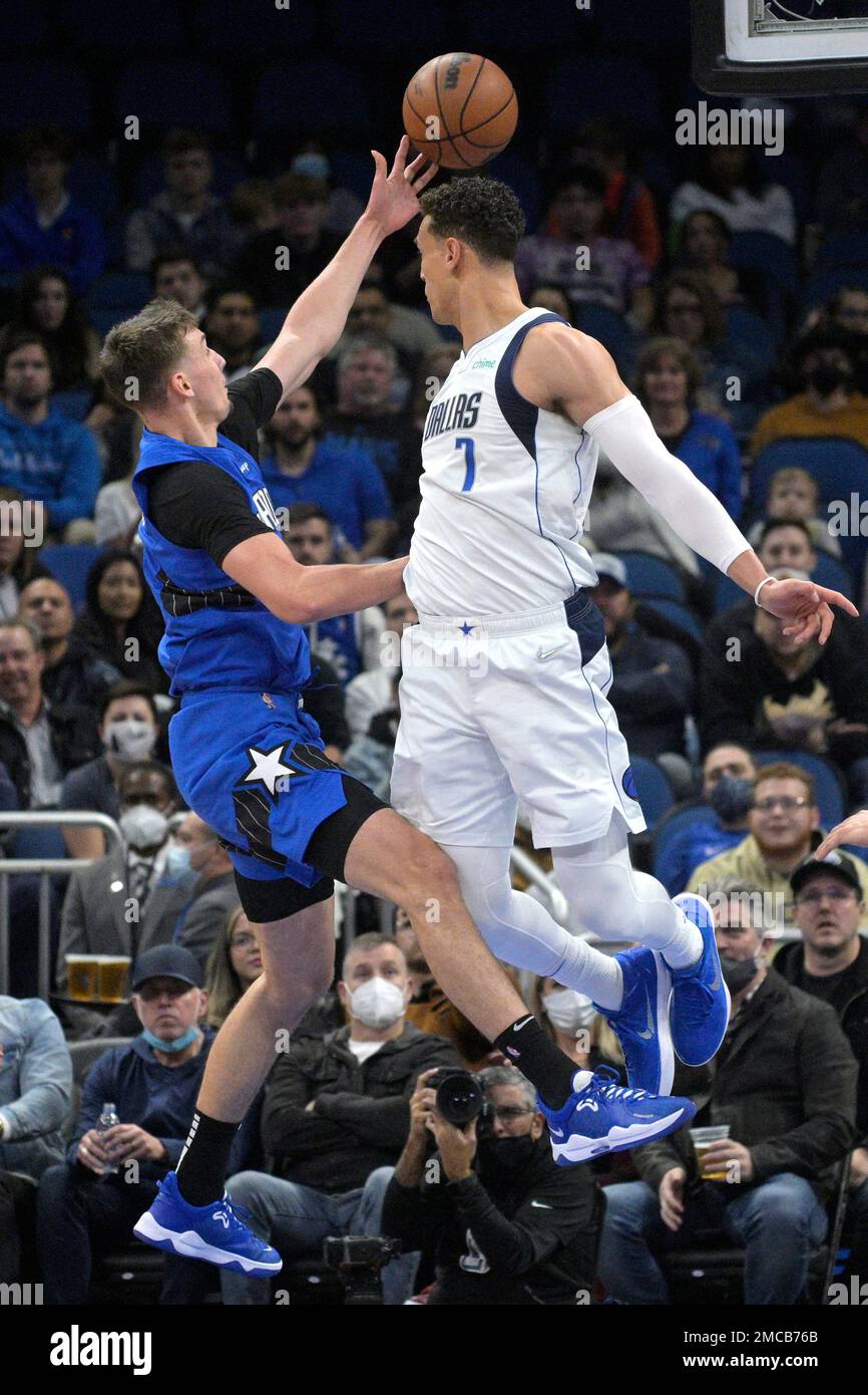 Orlando Magic forward Franz Wagner, left, goes up for a shot in front ...