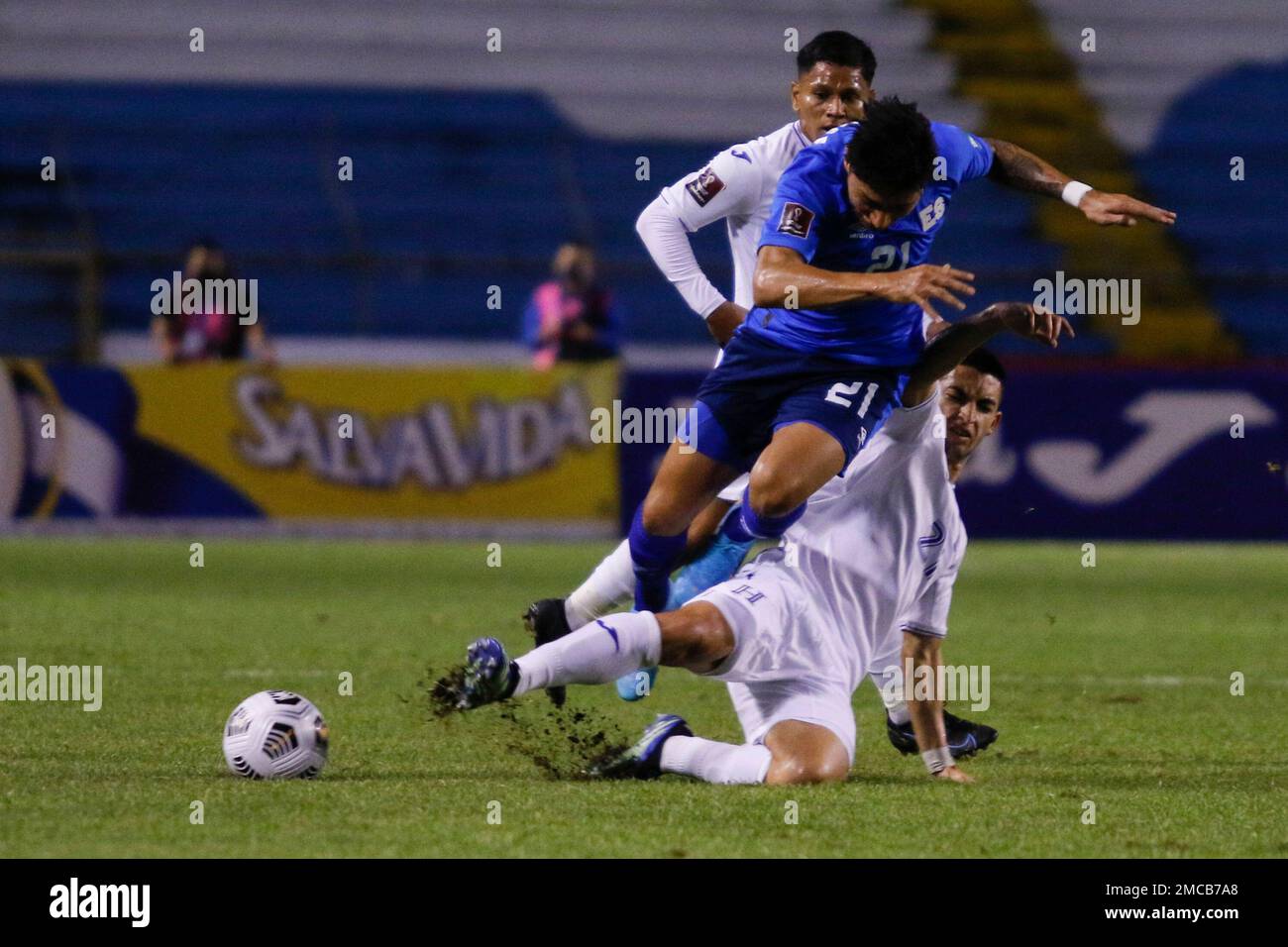 Honduras' Jonathan Rubio, bottom, and El Salvador's Bryan Tamacas fight for the ball during a ...