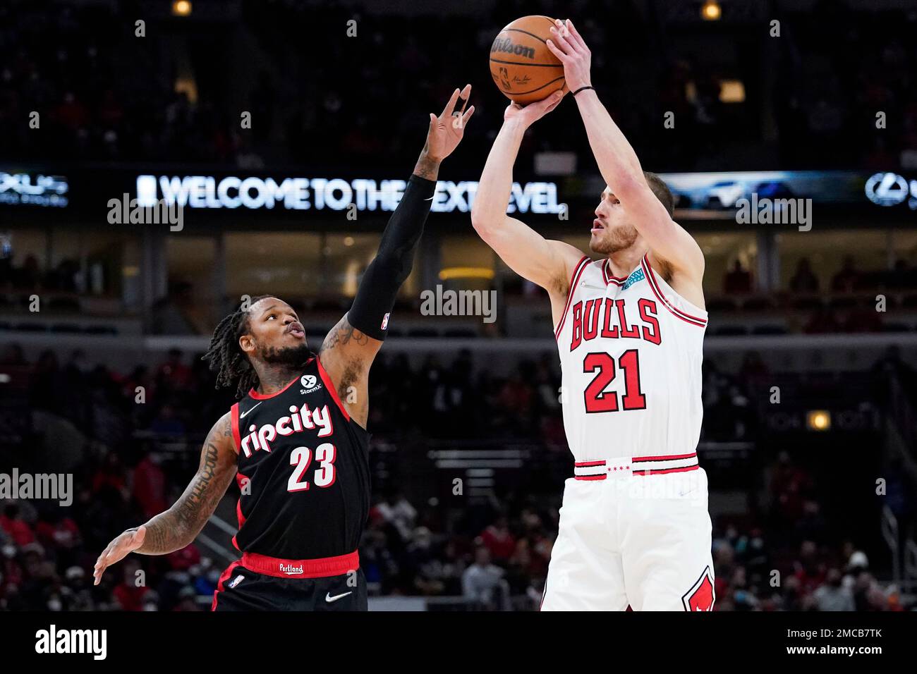 Chicago Bulls guard Matt Thomas, right, shoots over Portland Trail ...