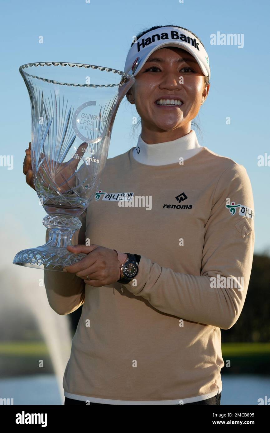 Lydia Ko of New Zealand smiles as she poses with the trophy after ...