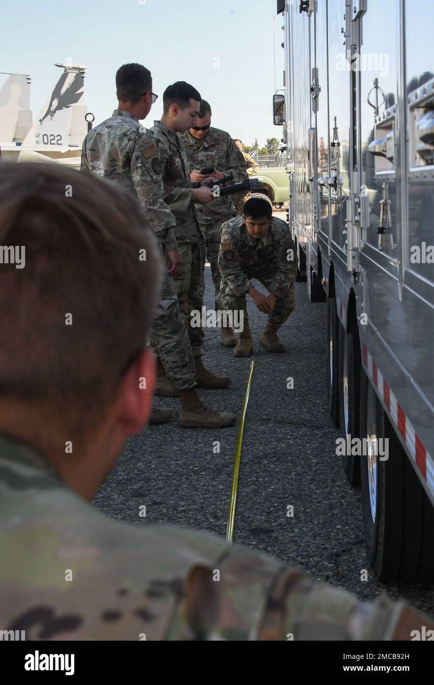 An mobility team from Travis Air Force Base takes measurements of the ...