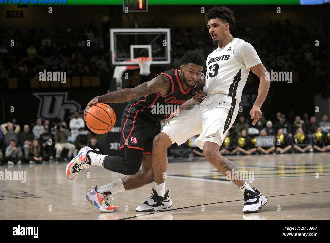Houston guard Jamal Shead (1) works against Central Florida guard ...